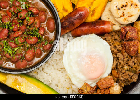 Traditional Colombian dish called Bandeja Paisa: a plate typical of ...