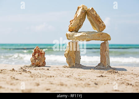 House made of stones against the sea, background sea. Sea stones on the ...