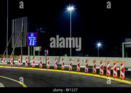 Motorway Signs and reflectors on Highway at night Stock Photo - Alamy
