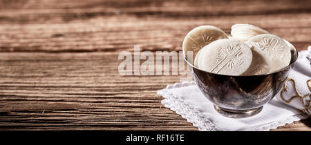 Bowl of sacramental bread or Hosties ready for the Holy Communion ...
