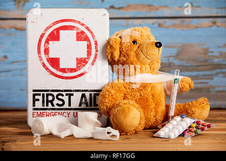 Paediatric healthcare concept with a little teddy bear with its arm in ...