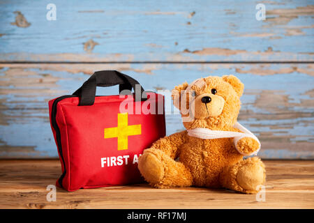 Paediatric healthcare concept with a little teddy bear with its arm in ...