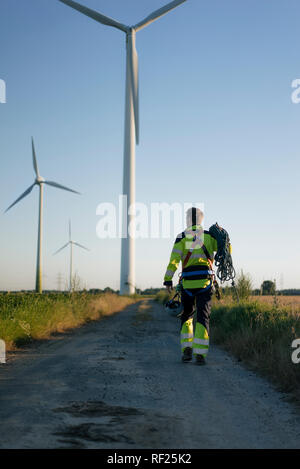 Workers labor on wind turbines at the Mingyang North Smart Energy ...