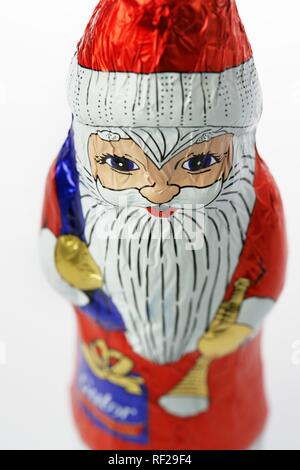 still life of chocolate santa clauses one already unwrapped Stock Photo ...