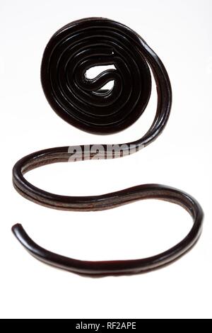 Liquorice snail, rolled black licorice Stock Photo - Alamy