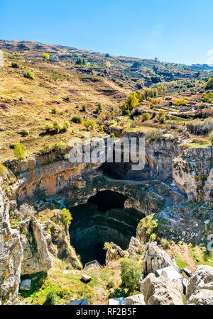 The green Baatara gorge sinkhole or the Cave of the Three Bridges with ...