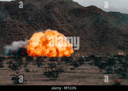 A U.S. Marine Corps M58 Mine Clearing Line Charge (MICLIC) fires a ...