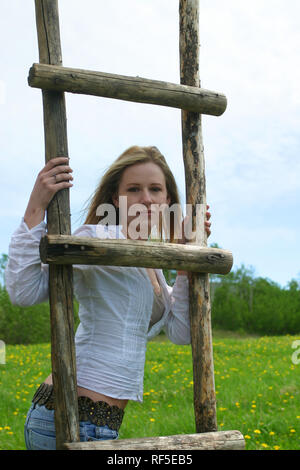 Very pretty blonde woman smiling, country setting, in her late twenties ...