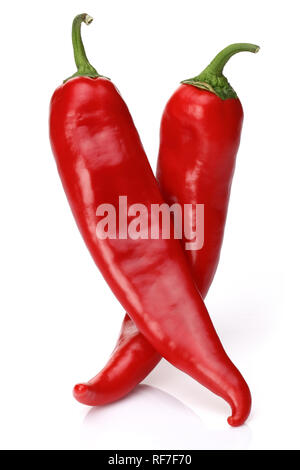 Bunch of two red peppers on a black slate ready to cook Stock Photo - Alamy