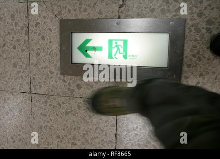 Emergency exit sign in Japan Stock Photo - Alamy