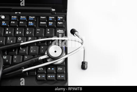 Electronic medical, stethoscope on PC/Laptop/Keyboard， blue toned ...