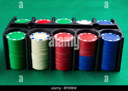 set of cashino chips on a green table Stock Photo - Alamy