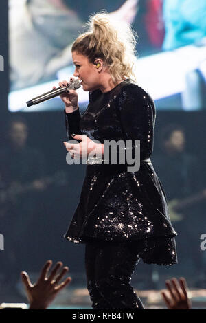 OAKLAND, CA - JANUARY 24: Kelly Clarkson performs during the opening ...