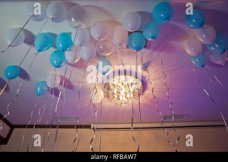 Balloons floating on the ceiling . Colorfull balloons float on the ...