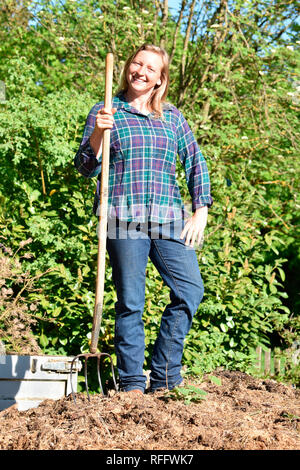 Woman mucking out, horse manure, muck-rake, dung fork, muck-heap Stock ...