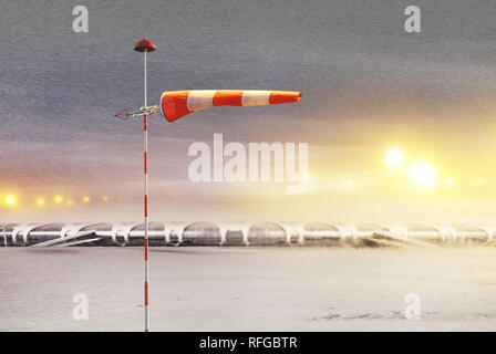 Meteorology windsock inflated by wind in airport at non-flying night ...