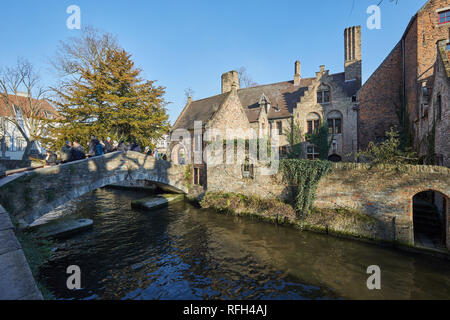 Tourists on the Bonifacius bridge over canal in Bruges, Belgium Stock ...