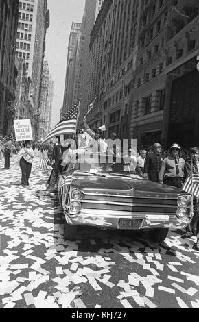 Demonstrators hold signs while participating in a national day of ...