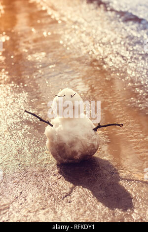 Snowman wait spring. Snowman is melting on spring day. Winter and ...