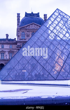 Pyramid and Louvre museum under snow, Paris, France Stock Photo - Alamy