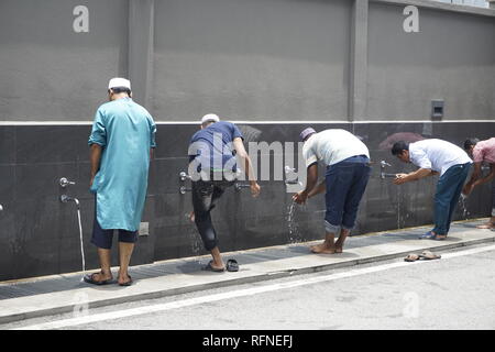 Muslim man washing before prayers at a mosque, Istanbul, Turkey Stock ...