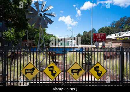 Woolloomooloo neighbourhood entrance sign with name written on a wall ...