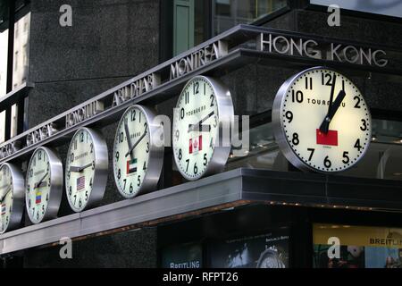 Midtown Manhattan, 5th Avenue. Tourneau clock store with many big ...