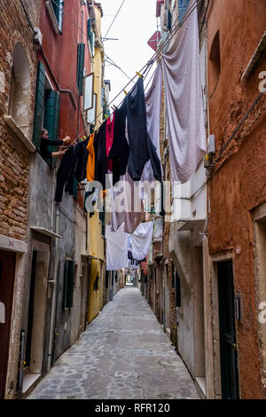 Laundry drying on washing lines in the communal courtyard at Well Court ...