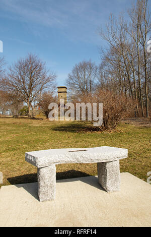 Granite bench along a walking path at Fort Foster Park in Kittery ...