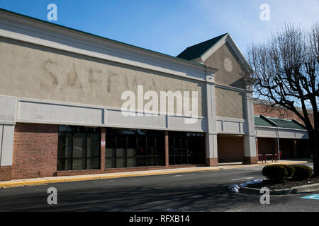A logo sign outside of a Safeway grocery retail store location in Olney ...