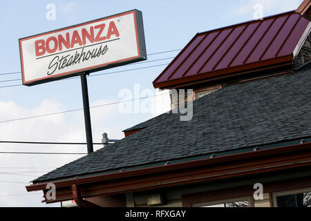 A logo sign outside of a Bonanza Steakhouse restaurant location in ...