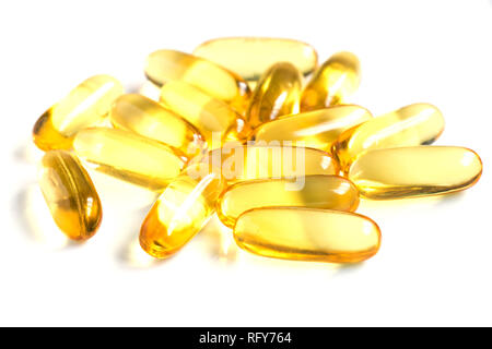 Yellow color soft gelatin capsule on white background (Concept of ...