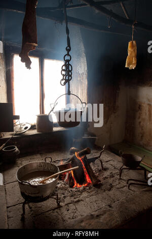 Open fireplace in traditional slovenian "black kitchen Stock Photo - Alamy