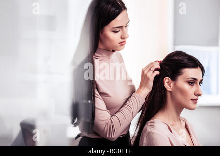 Young beautiful hairdresser looking for job after studying at courses ...