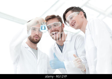 happy scientists look at the result of their work Stock Photo - Alamy