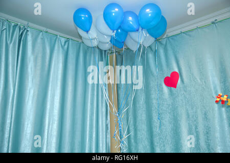 Balloons floating on the ceiling . Colorfull balloons float on the ...