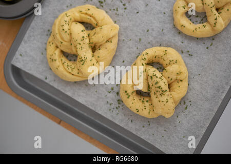 Twisted dough arranges in baking tray Stock Photo - Alamy