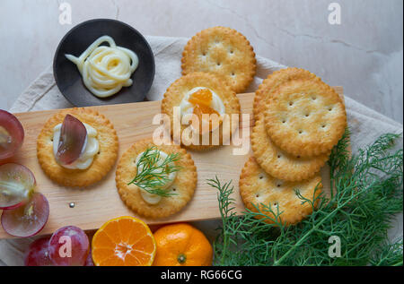 Biscuit Canape serving on wooden board Stock Photo - Alamy