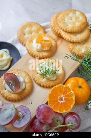 Biscuit Canape serving on wooden board Stock Photo - Alamy