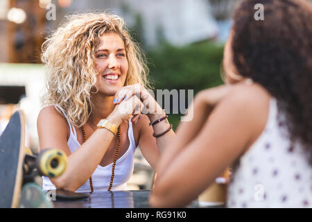 Women friends Socialize and talking Together while coffee break in ...