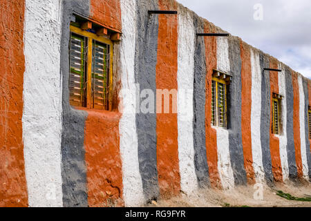 Colorfully painted buildings of the monastery, located on a hill in ...