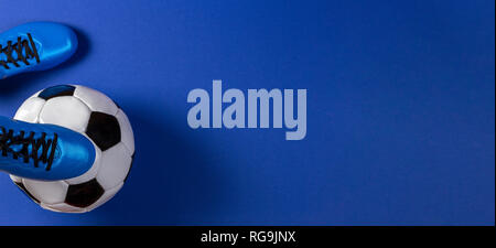 Soccer ball under soccer player's feet, isolated on white background ...