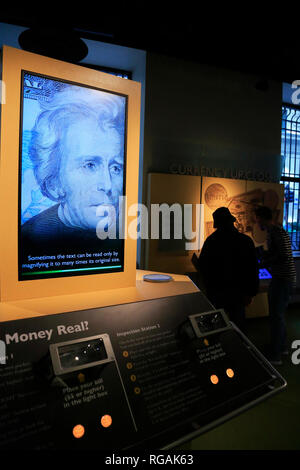 A screen showing detailed security features in US dollar paper currency ...