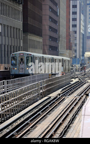 Chicago "L" trains running on elevated railroad tracks in the Loop of ...