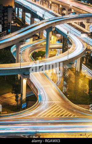an aerial shot of A highway interchange in the Takao Mountain, near ...