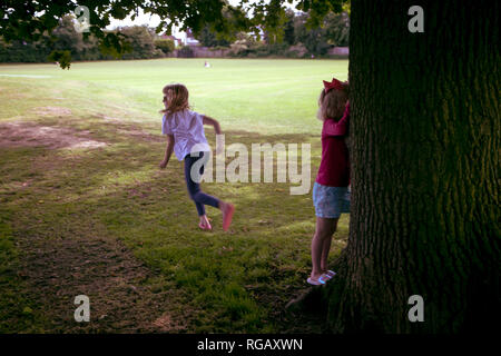 Sisters playing hide and seek Stock Photo: 28757510 - Alamy