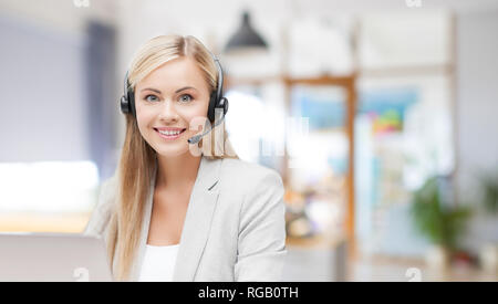 Business and technology concept - helpline female operator with ...