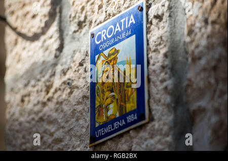 Friday 31 August 2018 Pictured: A woman sits on a narrow street in Hvar ...
