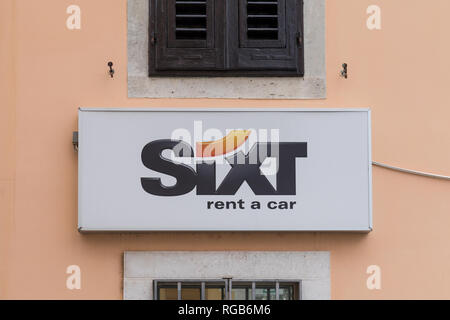 Sixt company logo at the car rental desk of Sixt AG at Munich Stock ...