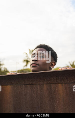 curious young man looking over shoulder to side, sitting isolated on ...